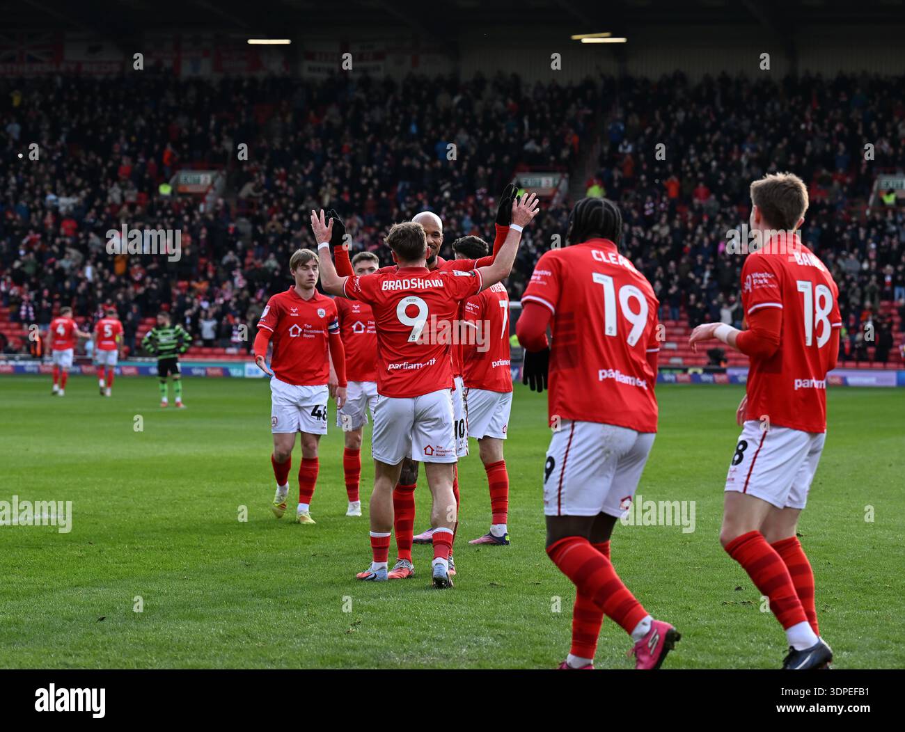 Barnsley's players celebrate Tom Bradshaw's goal in the match between ...