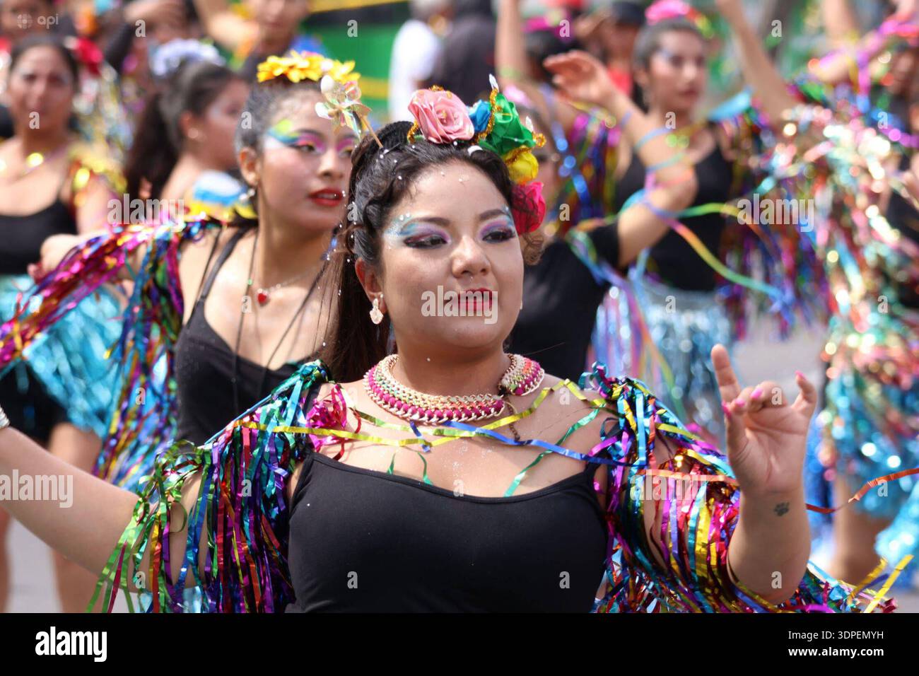 CARNAVAL DE COLORES QUITO February 14, 2026 Students participate in the ...