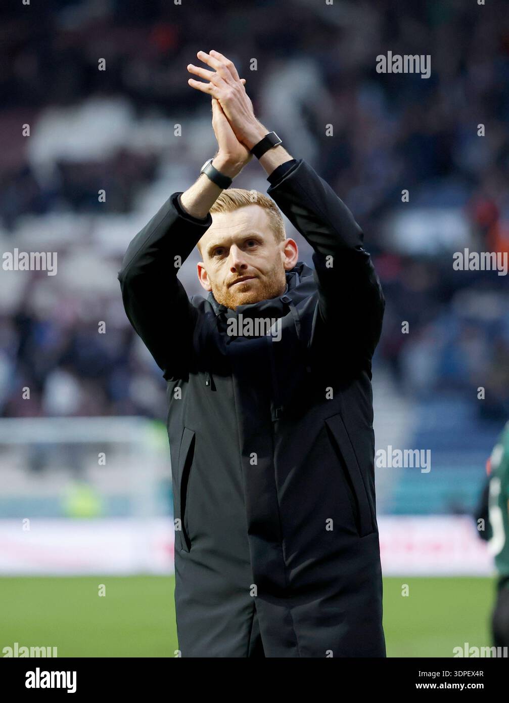 Watford manager Edward Still applauds the fans at full time following ...