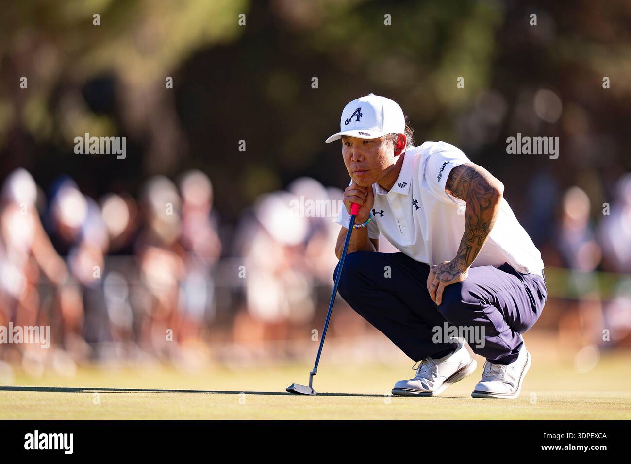 Anthony Kim of 4Aces GC looks over the 18th green during the third ...