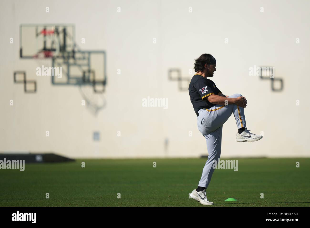 Pittsburgh Pirates' Jared Jones stretches during spring training ...