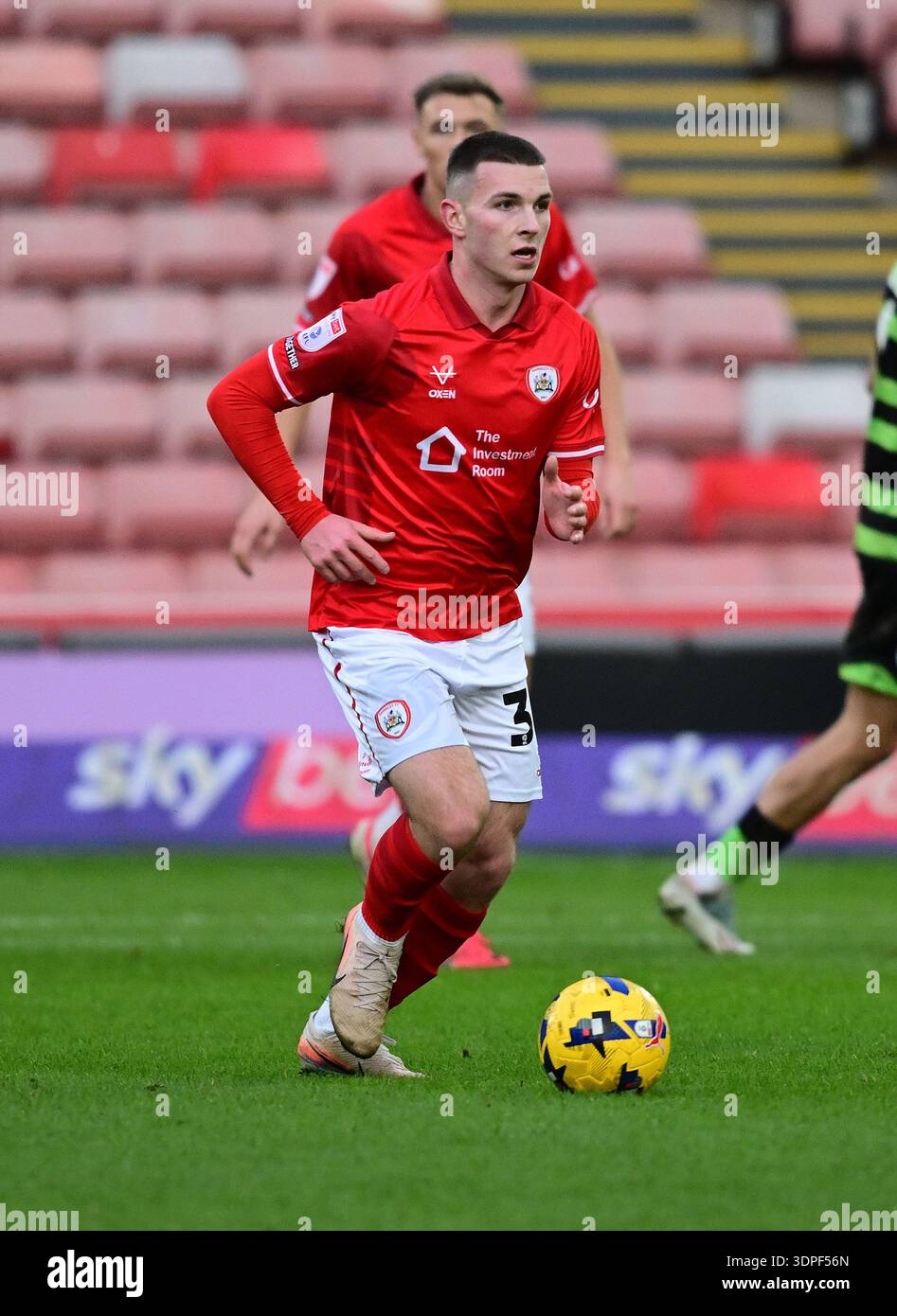 Barnsley's Jonathan Bland dribbles with the ball in the match between ...