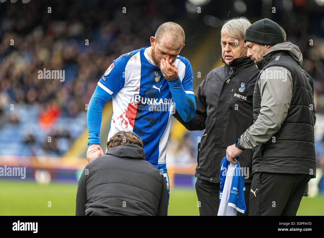 Oldham Athletic's Joe Garner receives treatment during the Sky Bet ...