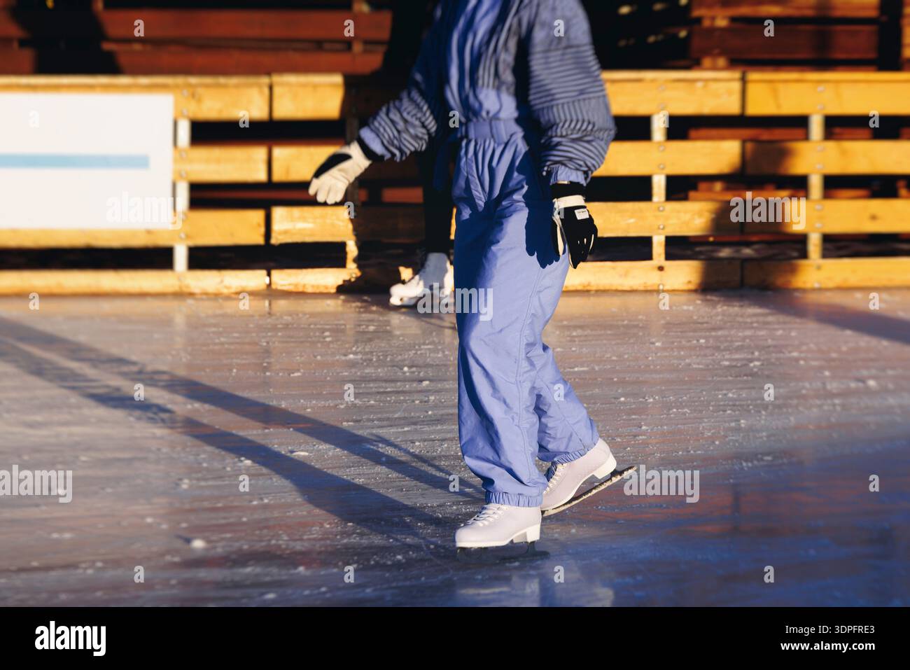 Ice skating on the ice rink arena with people, skating rink surface ...
