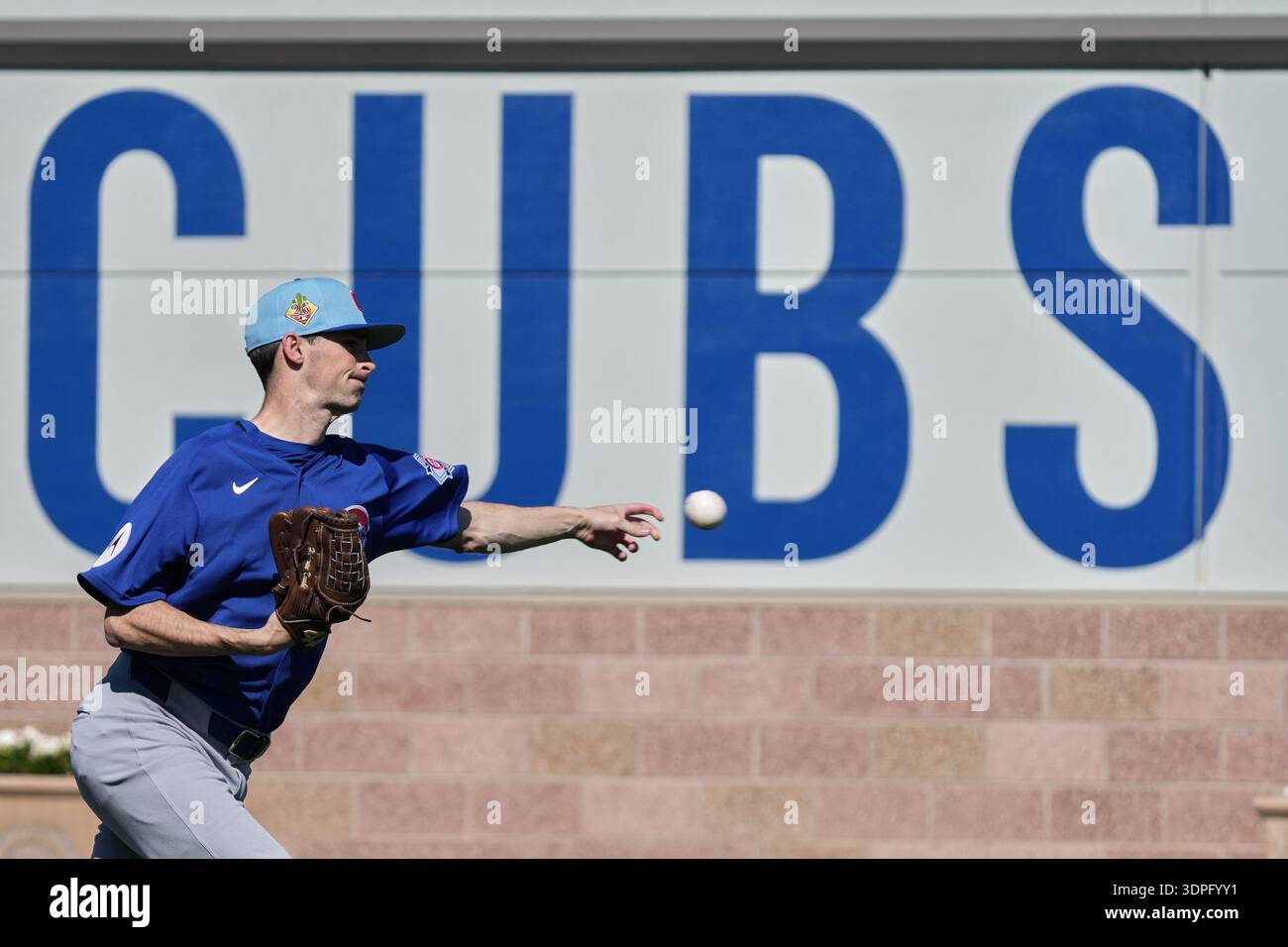 Chicago Cub's Hoby Milner throws during a spring training baseball ...