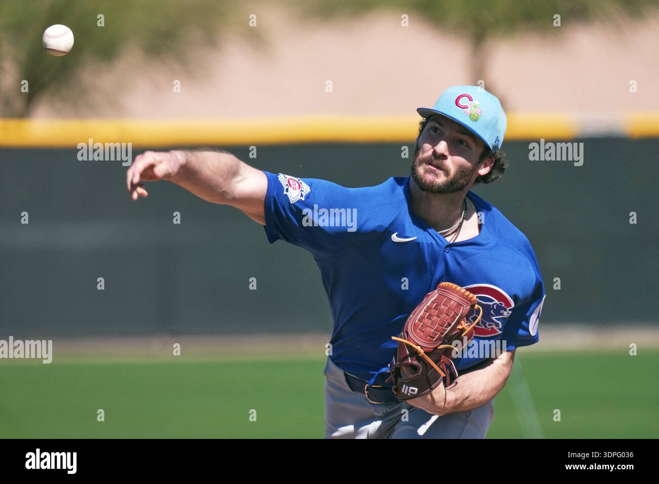 Chicago Cub's Jack Neely throws during a spring training baseball ...
