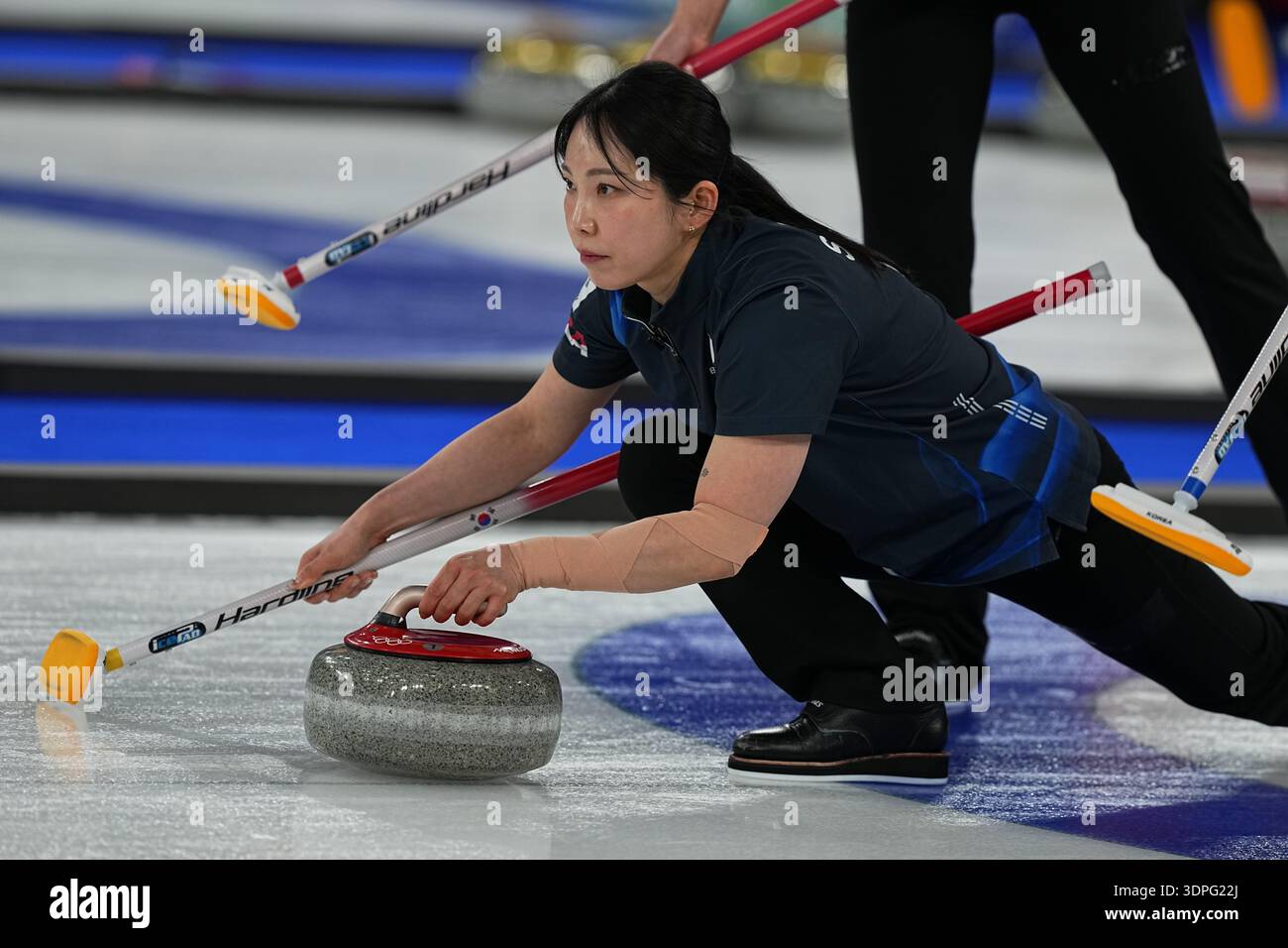South Korea's Kim Su-ji in action during the women's curling round ...