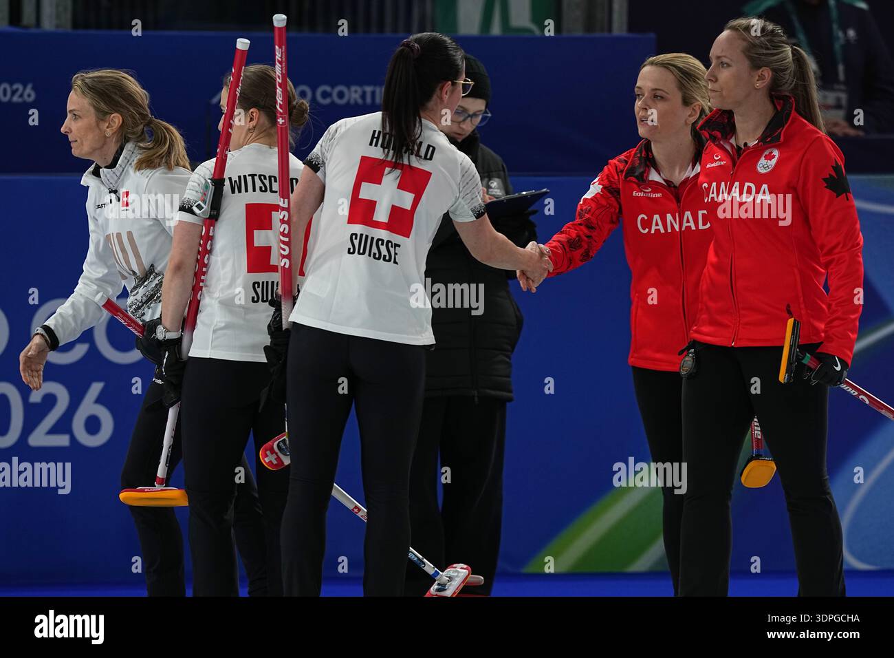 Switzerland's Carole Howald shakes hands with Canada's Tracy Fleury ...