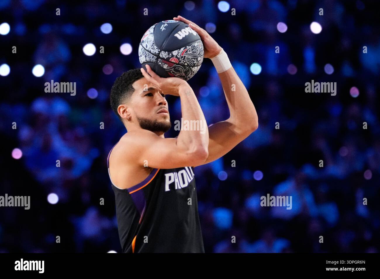Phoenix Suns guard Devin Booker shoots during the 3-point contest at ...