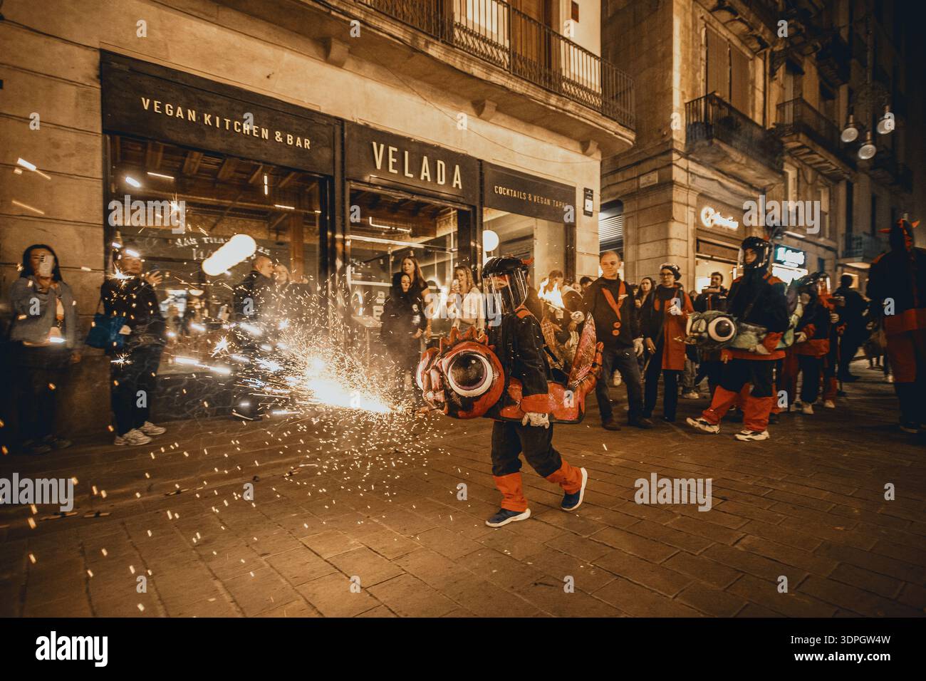 Barcelona, Spain. 14 February, 2026: Little fire runners in devil ...