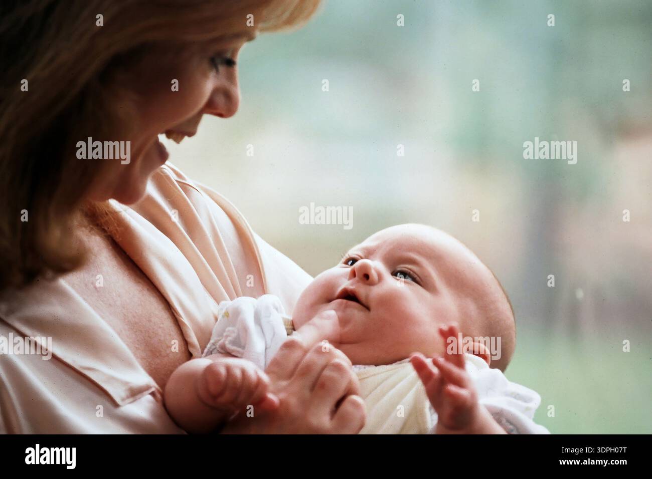 Baby looks through window hi-res stock photography and images - Alamy