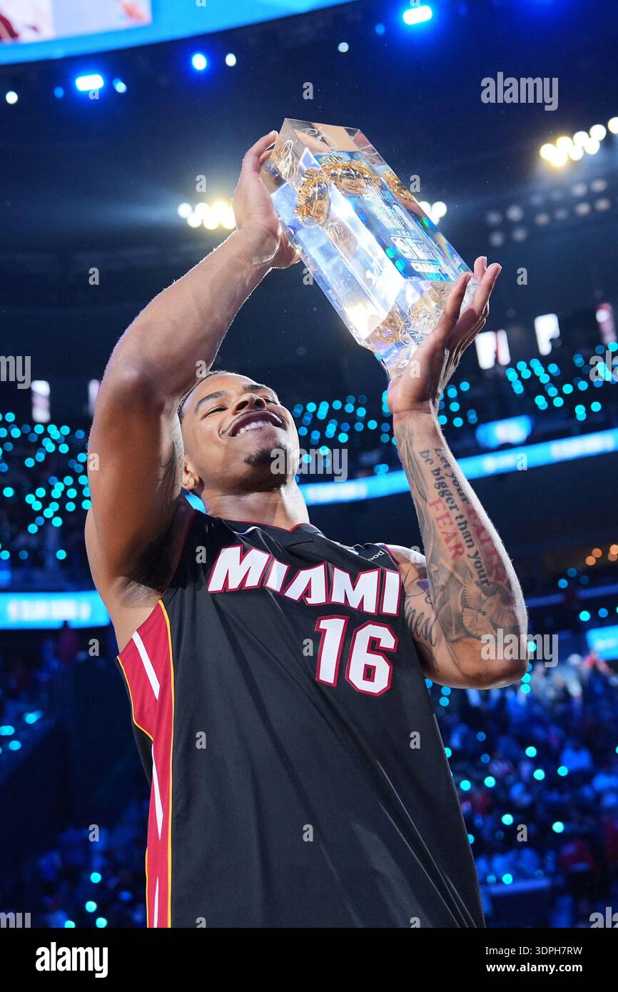 Miami Heat forward Keshad Johnson holds the winner's trophy after ...