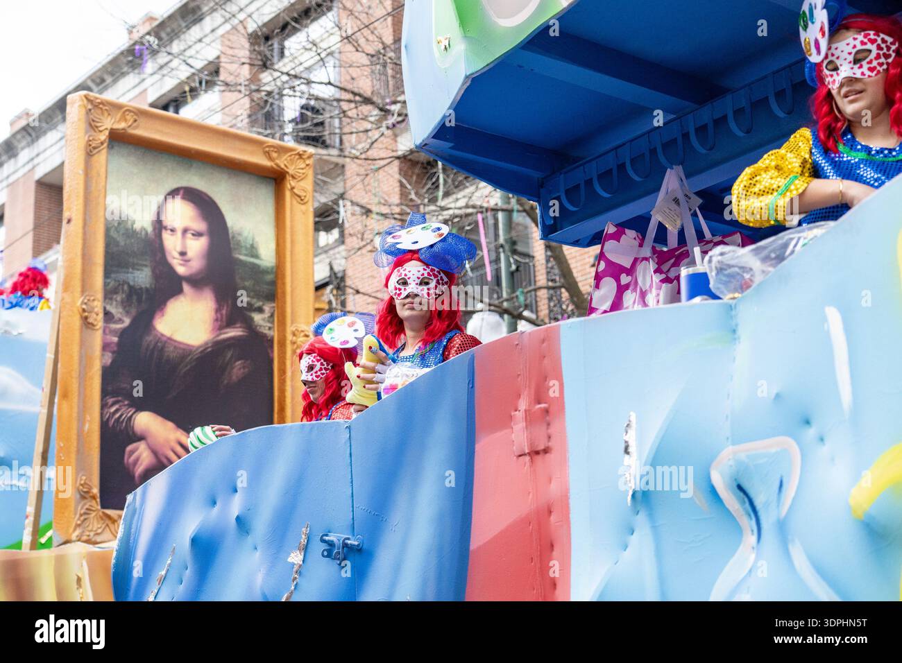 Attendees march during the annual Krewe of Iris parade during the Mardi ...