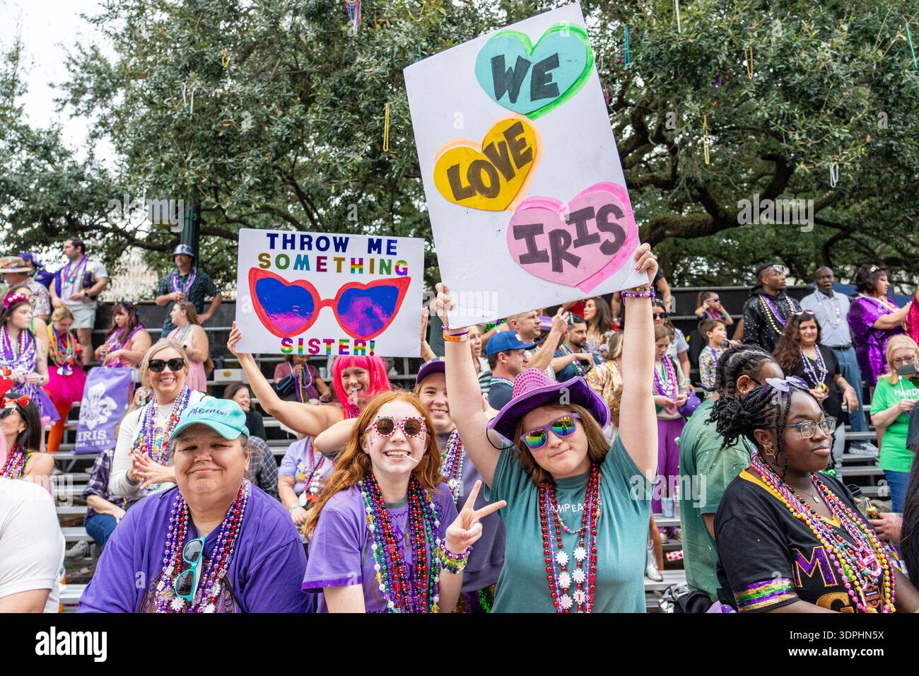 Attendees march during the annual Krewe of Iris parade during the Mardi ...