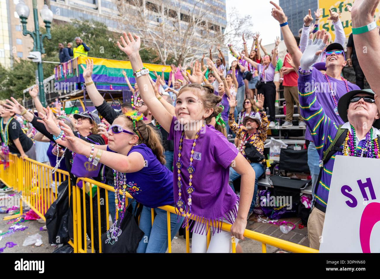 Attendees march during the annual Krewe of Iris parade during the Mardi ...
