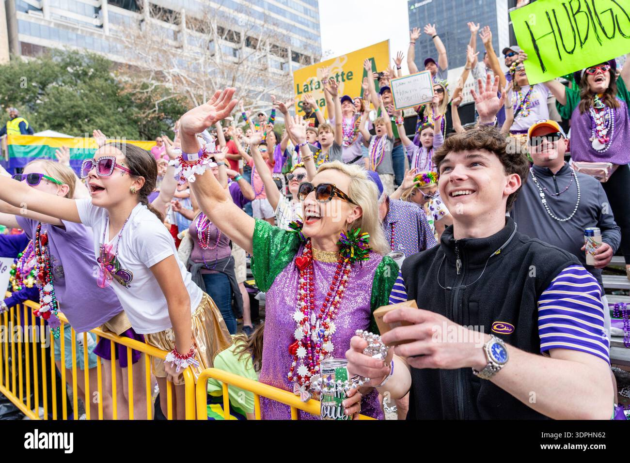 Attendees march during the annual Krewe of Iris parade during the Mardi ...