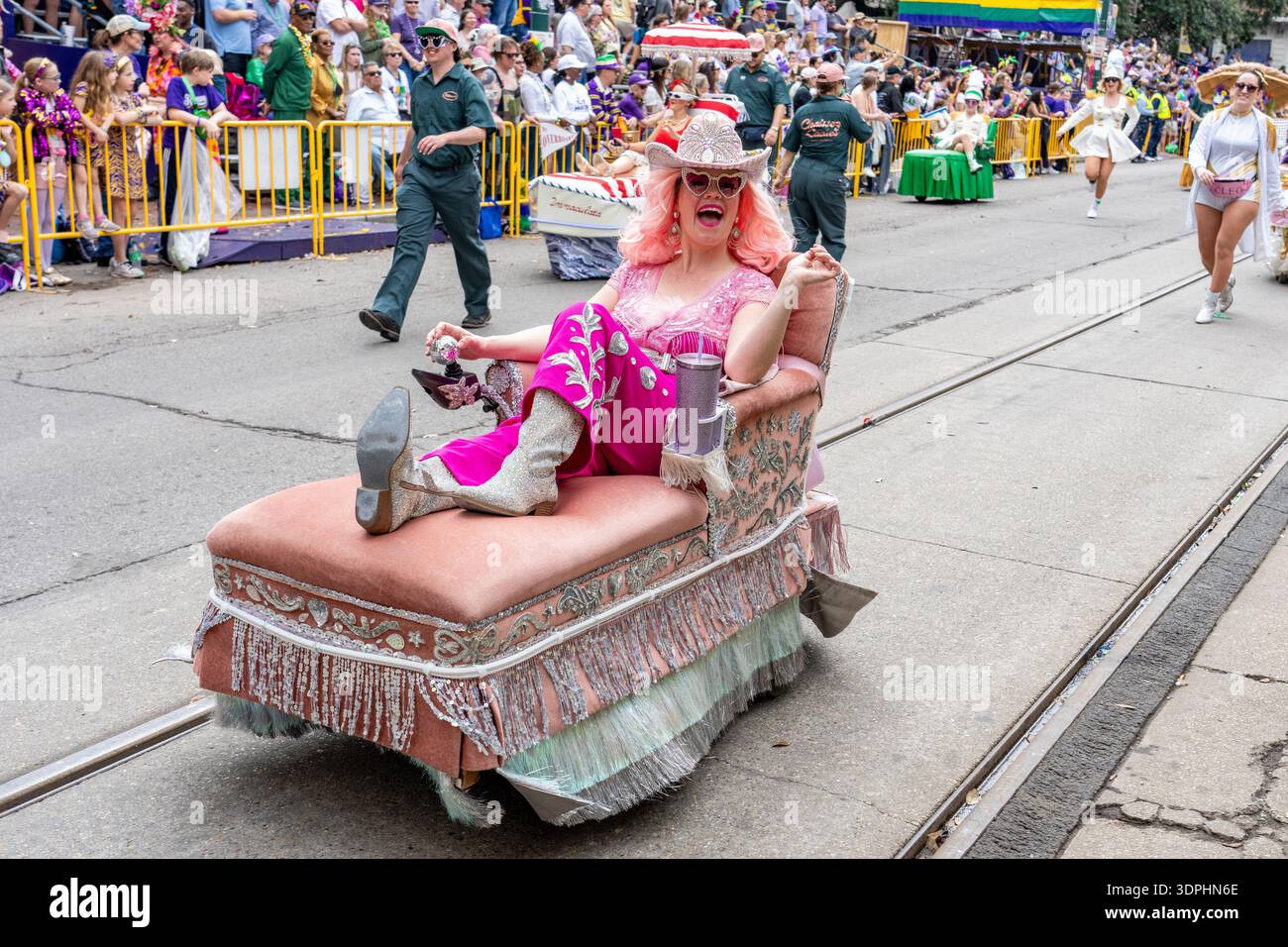 Attendees march during the annual Krewe of Iris parade during the Mardi ...