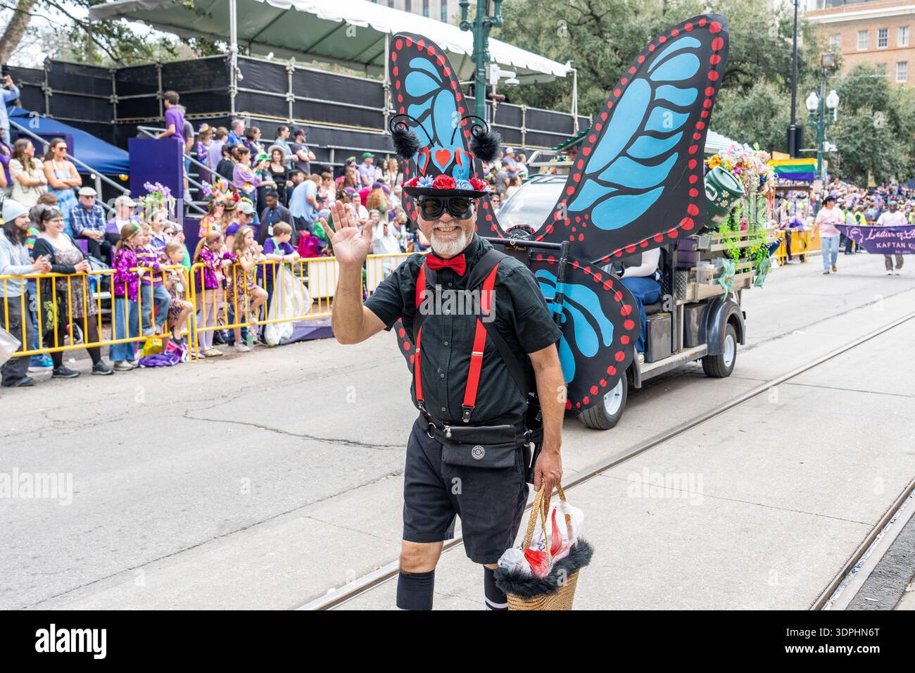 Attendees march during the annual Krewe of Iris parade during the Mardi ...