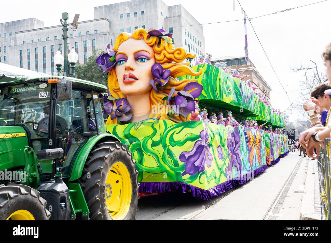Attendees march during the annual Krewe of Iris parade during the Mardi ...