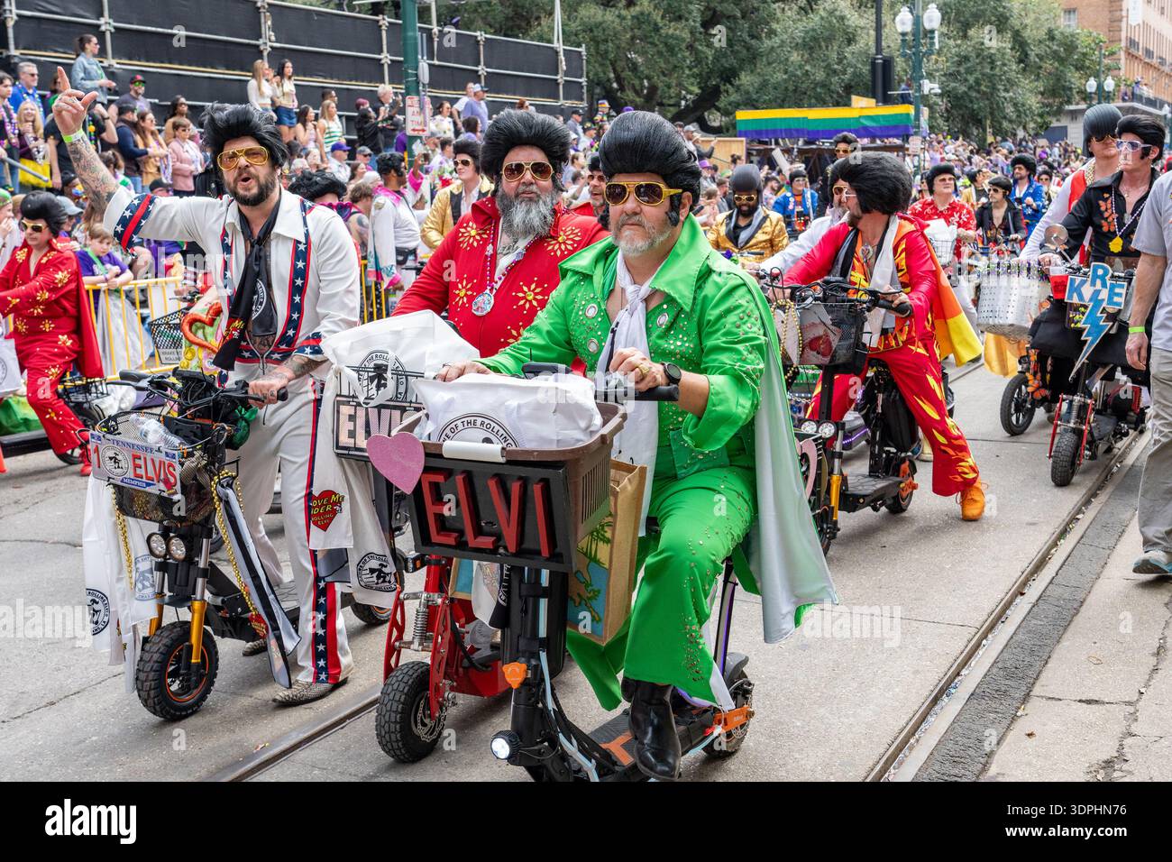 Attendees march during the annual Krewe of Iris parade during the Mardi ...