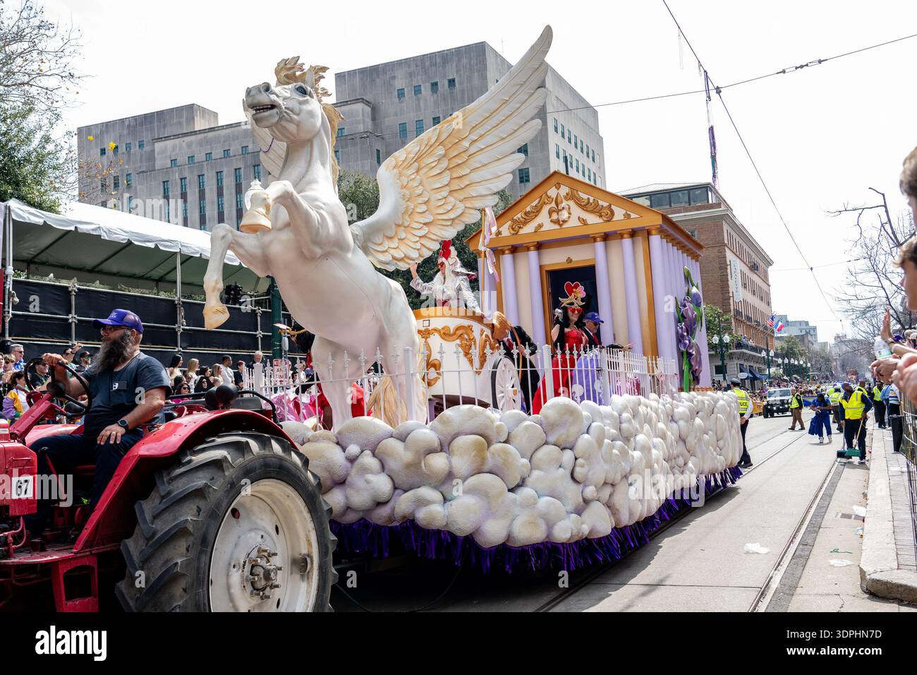 Attendees march during the annual Krewe of Iris parade during the Mardi ...