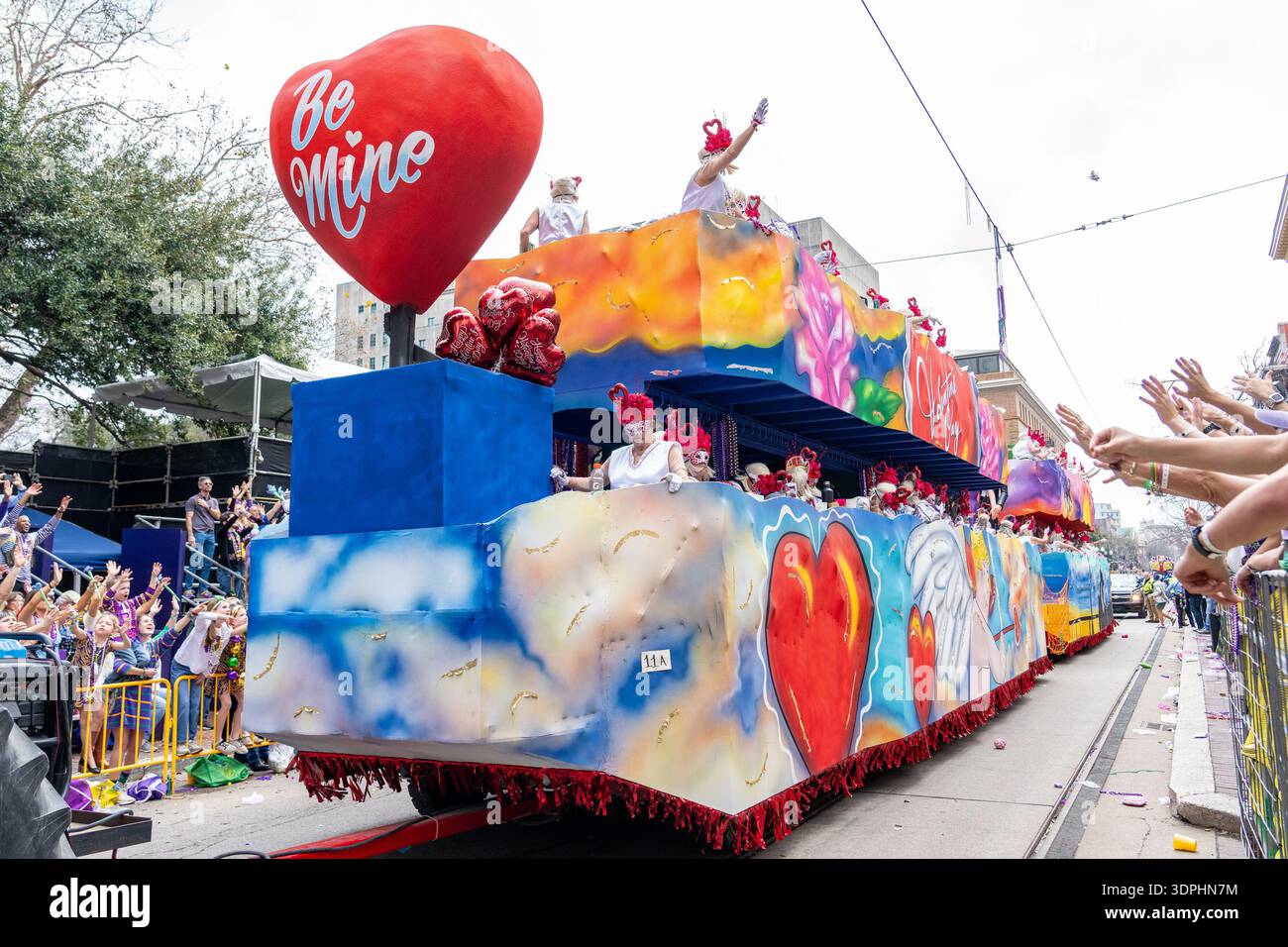 Attendees march during the annual Krewe of Iris parade during the Mardi ...