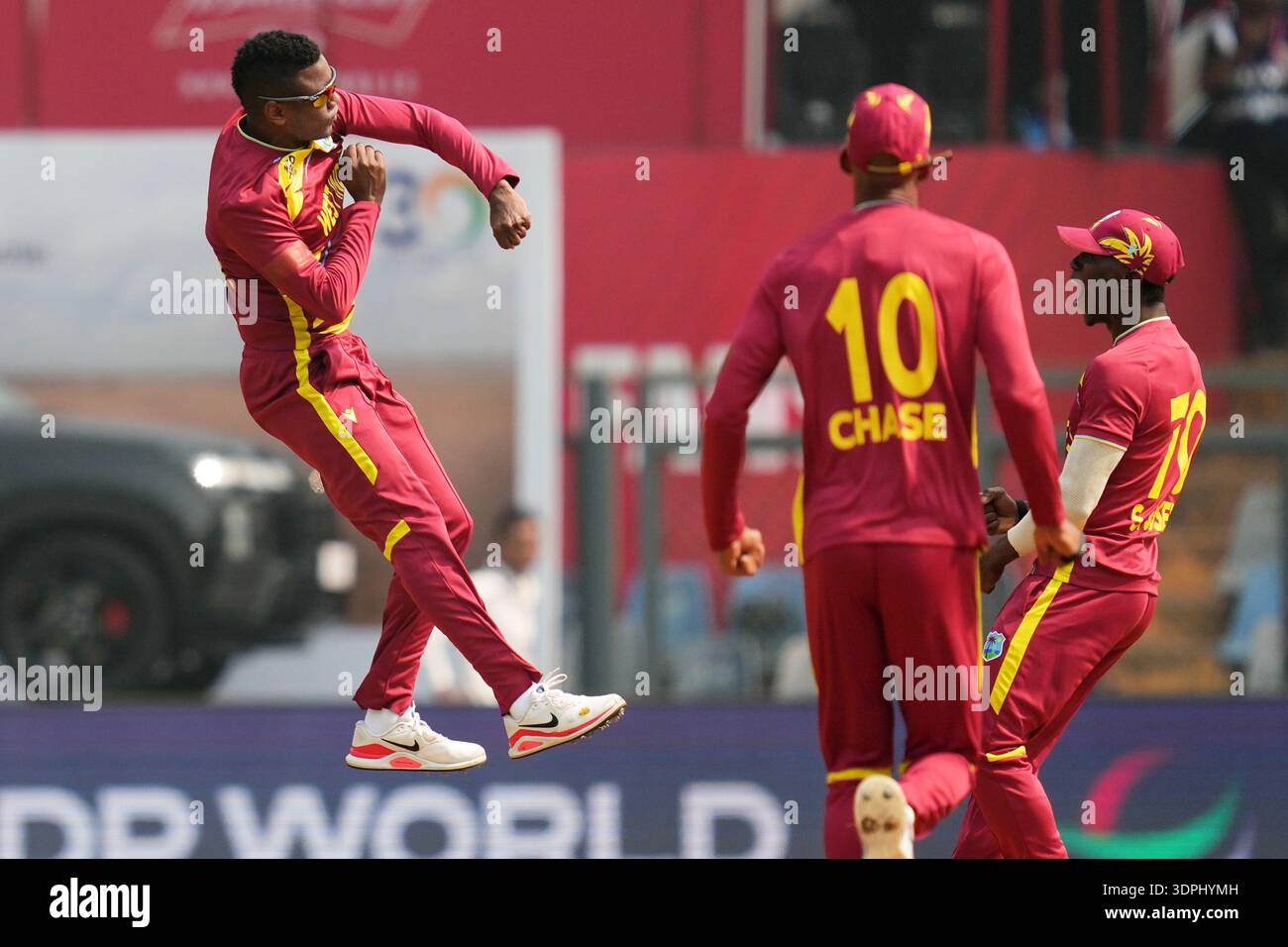 West Indies' Akeal Hosein celebrates the wicket of Nepal's Kushal ...
