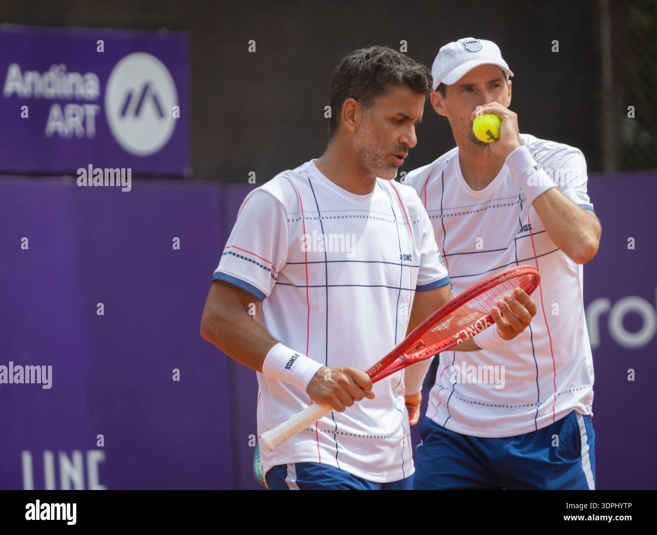 Argentinian players Maximo Machi Gonzalez and Andres Molteni serving at ...