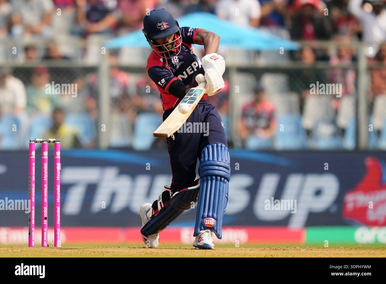 Nepal's Aasif Sheikh hits a boundary during the T20 World Cup cricket ...
