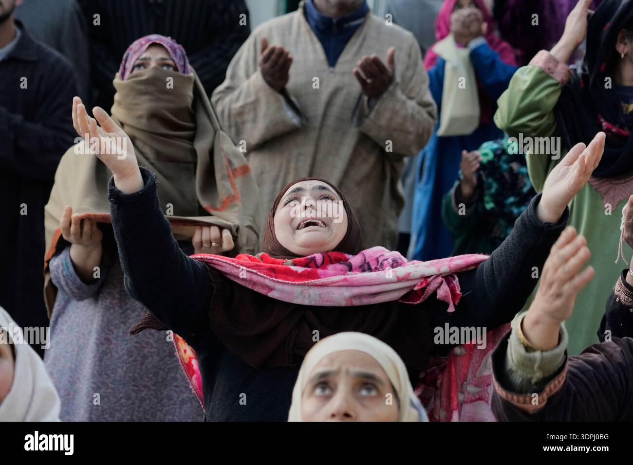 FILE - Muslim devotees pray as the head priest displays a holy relic ...