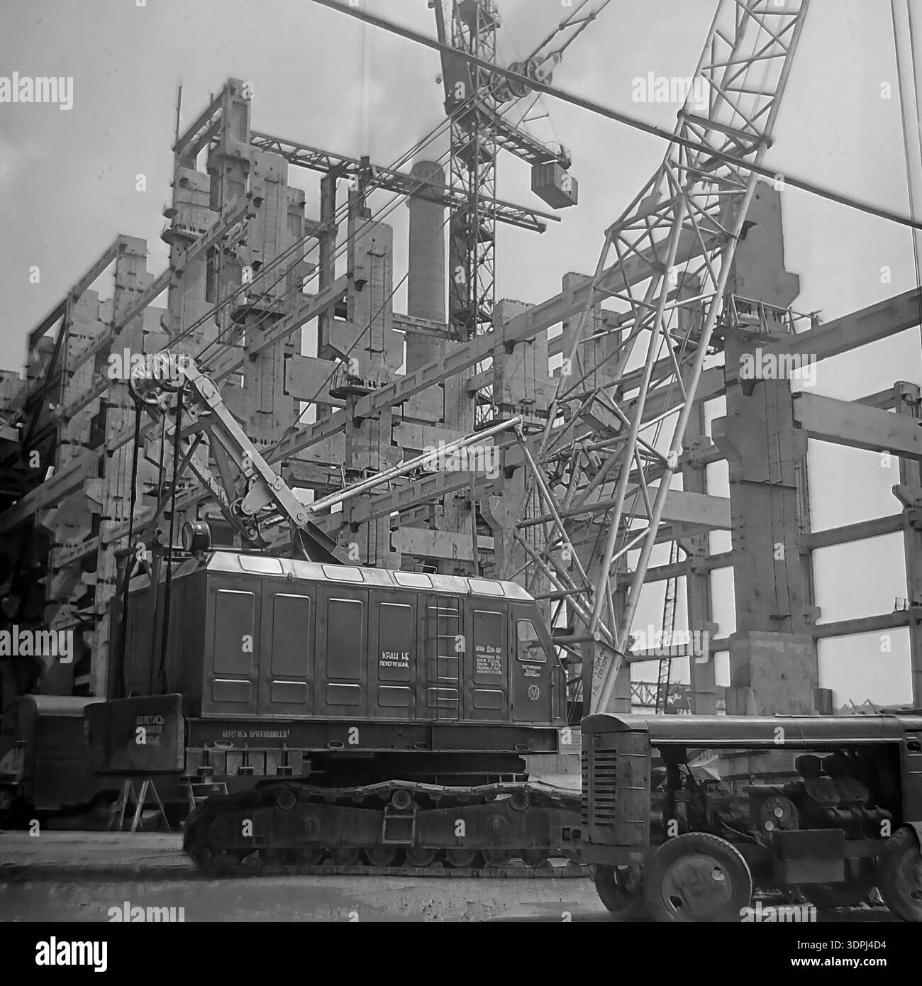 A compelling archival photograph from the 1960s featuring a heavy-duty ...