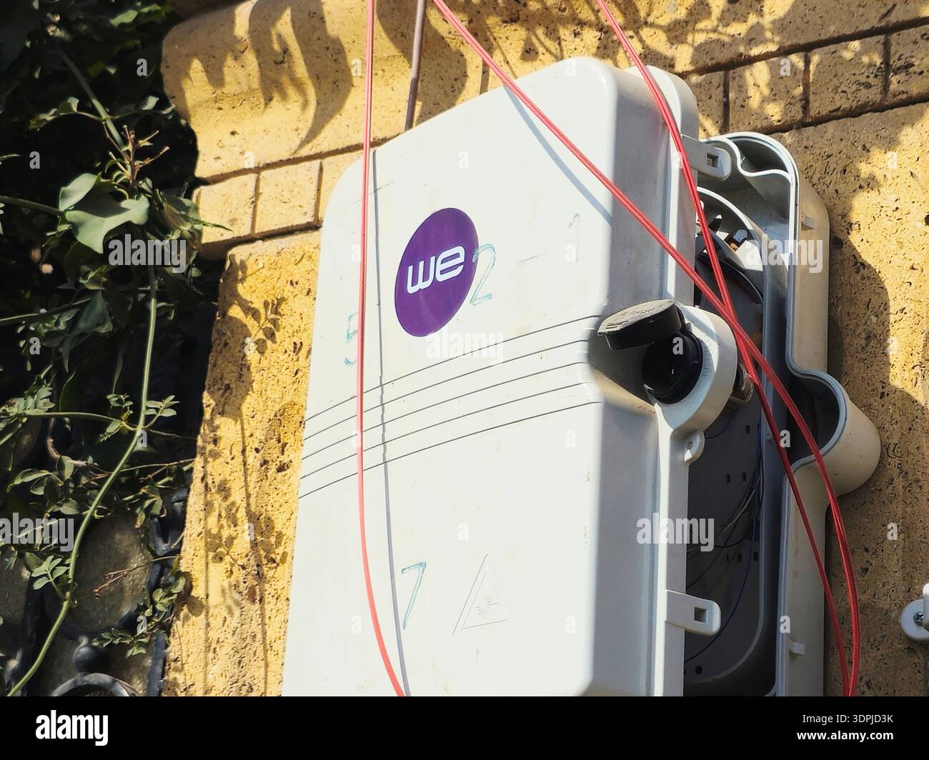 Giza, Egypt, February 4 2026: WE outdoor fiber optic terminal box ...