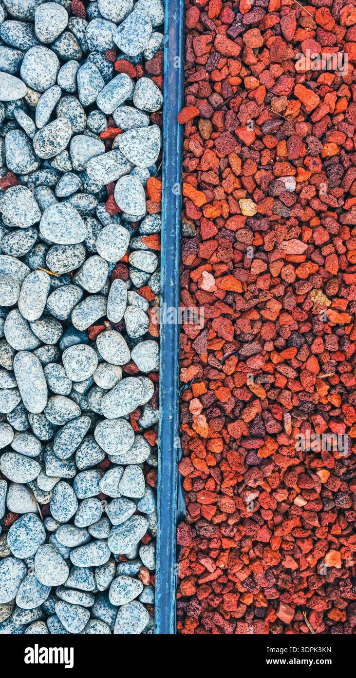 Red Volcanic Lava Rocks and White Garden Pebbles Separated by Edging ...