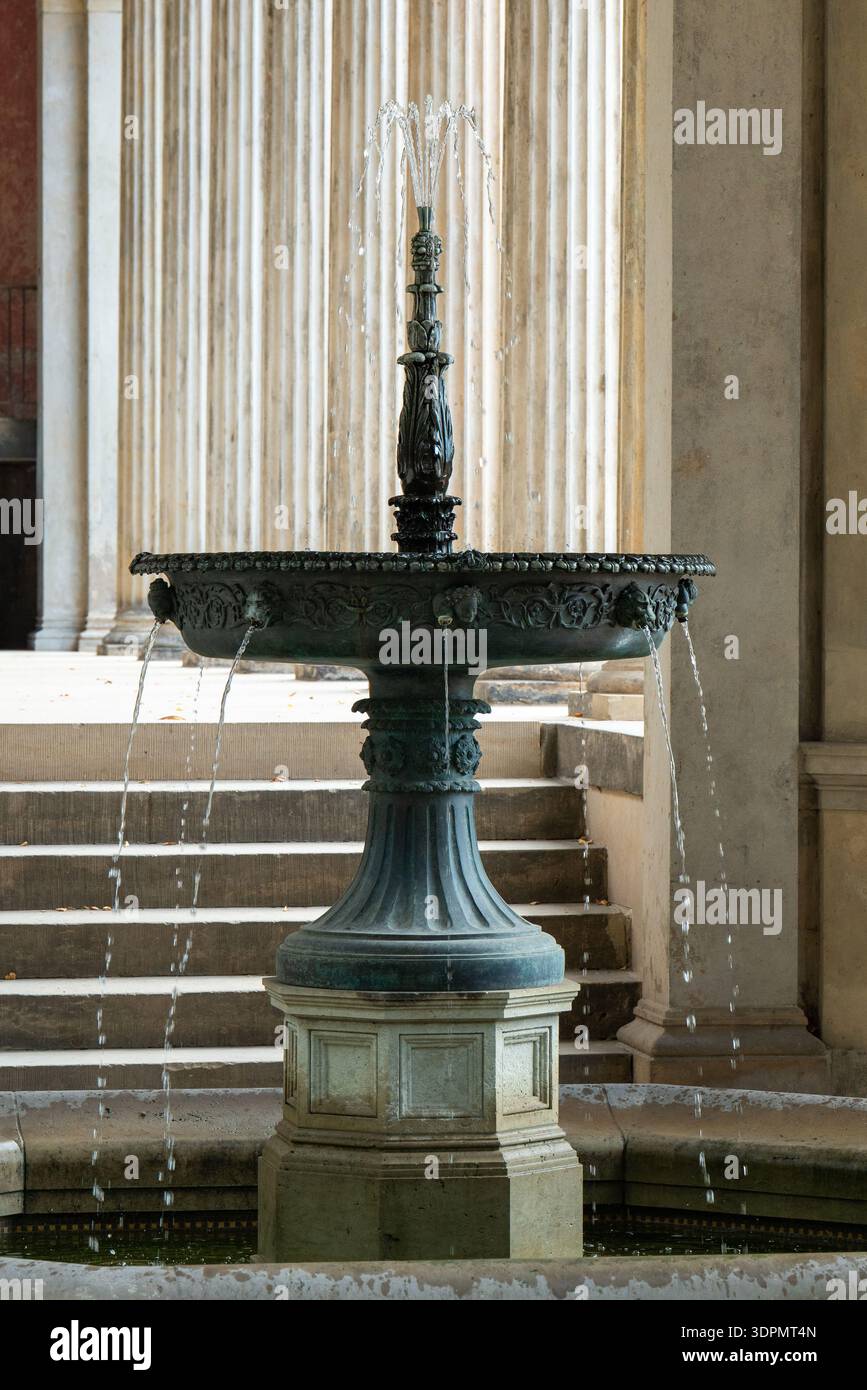 Fountain framed by classical columns and arches at Lingner Castle ...