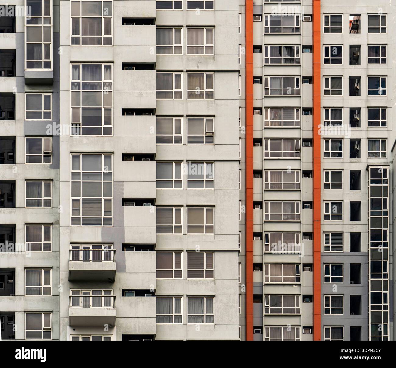 Facade of modern high-rise apartment building with repeating windows ...