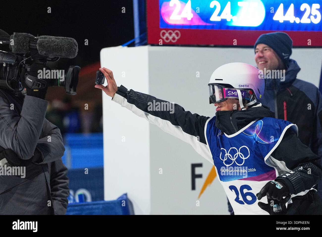 New Zealand's Lucas Ball shows a cameraperson a message on his phone ...