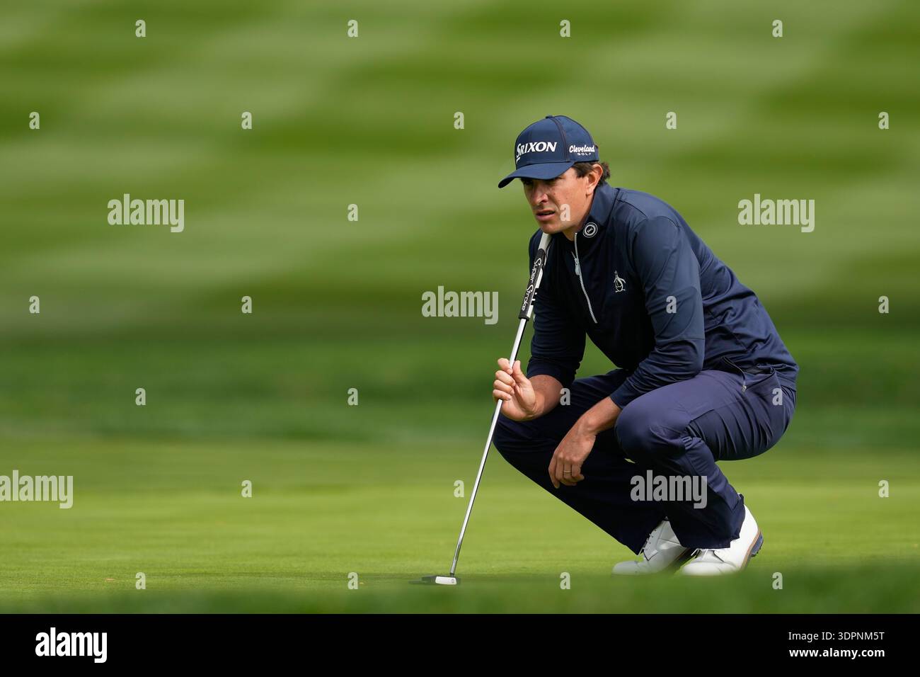 Nico Echavarria, from Colombia, prepares to putt on the 16th green at ...