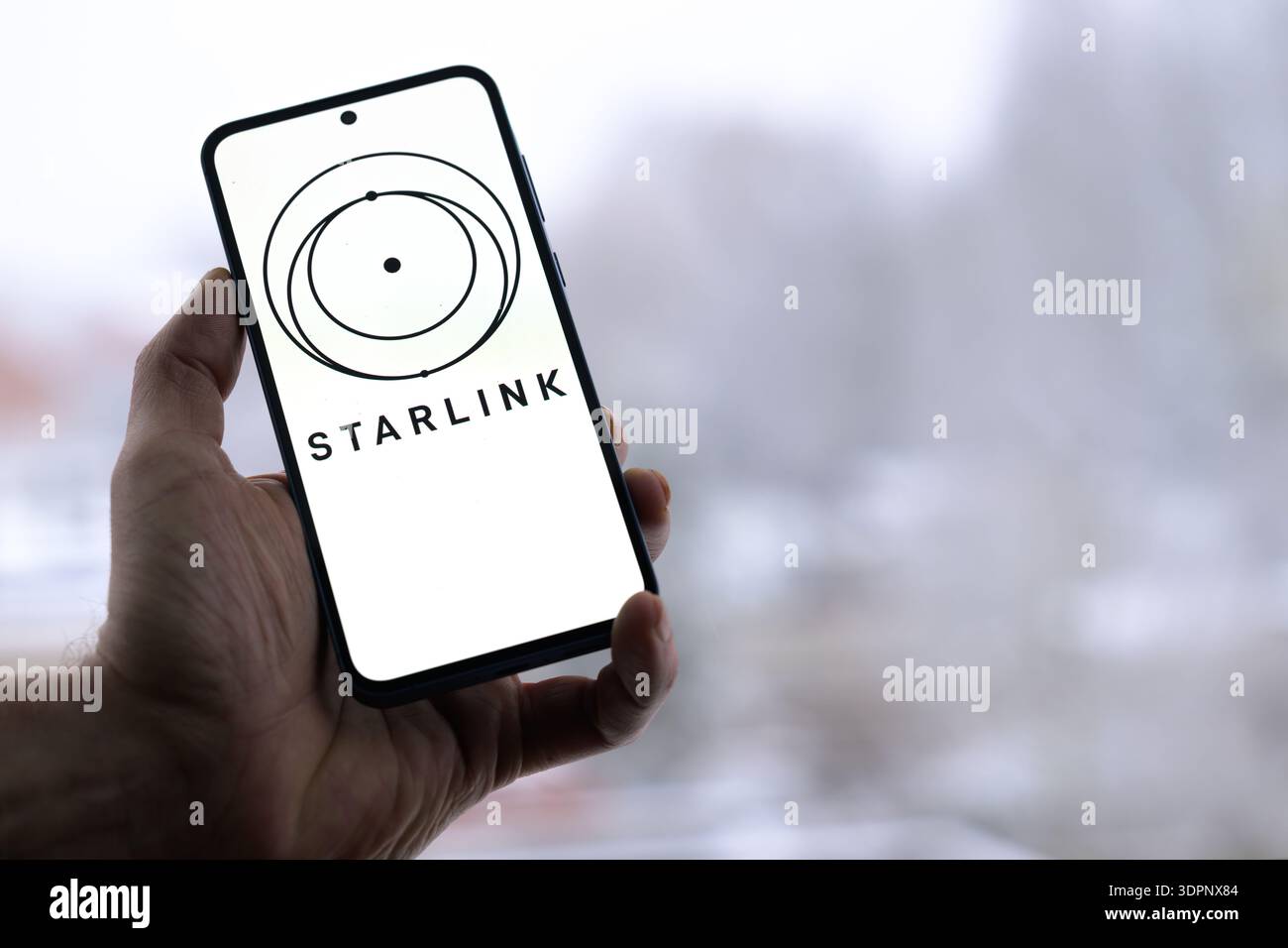The Starlink is displayed on a mobile phone, seen in this photo ...