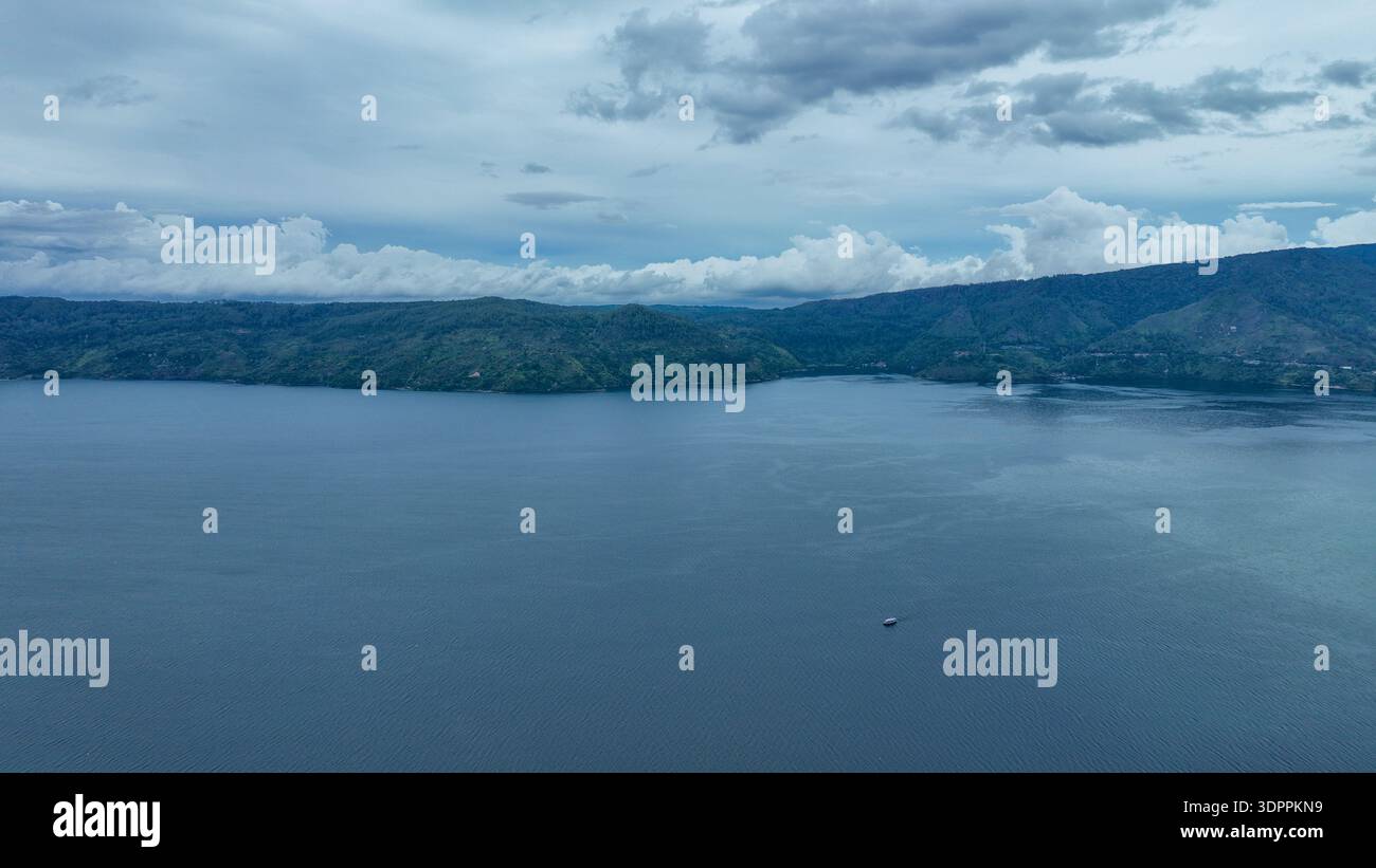 Samosir Island jewel in Lake Toba, Sumatra, cradled by misty volcanic ...