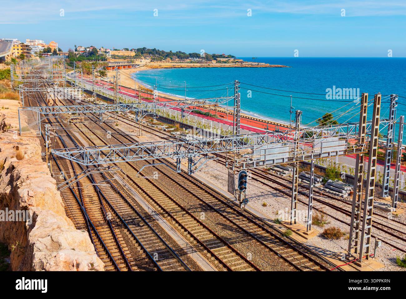 Overlook of coastal railway infrastructure running alongside promenade ...