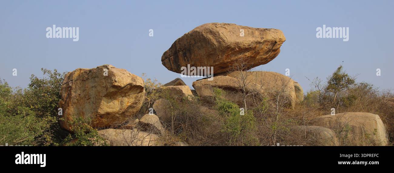 Big balancing granite boulder in Sanapur, villige near Hampi, India ...