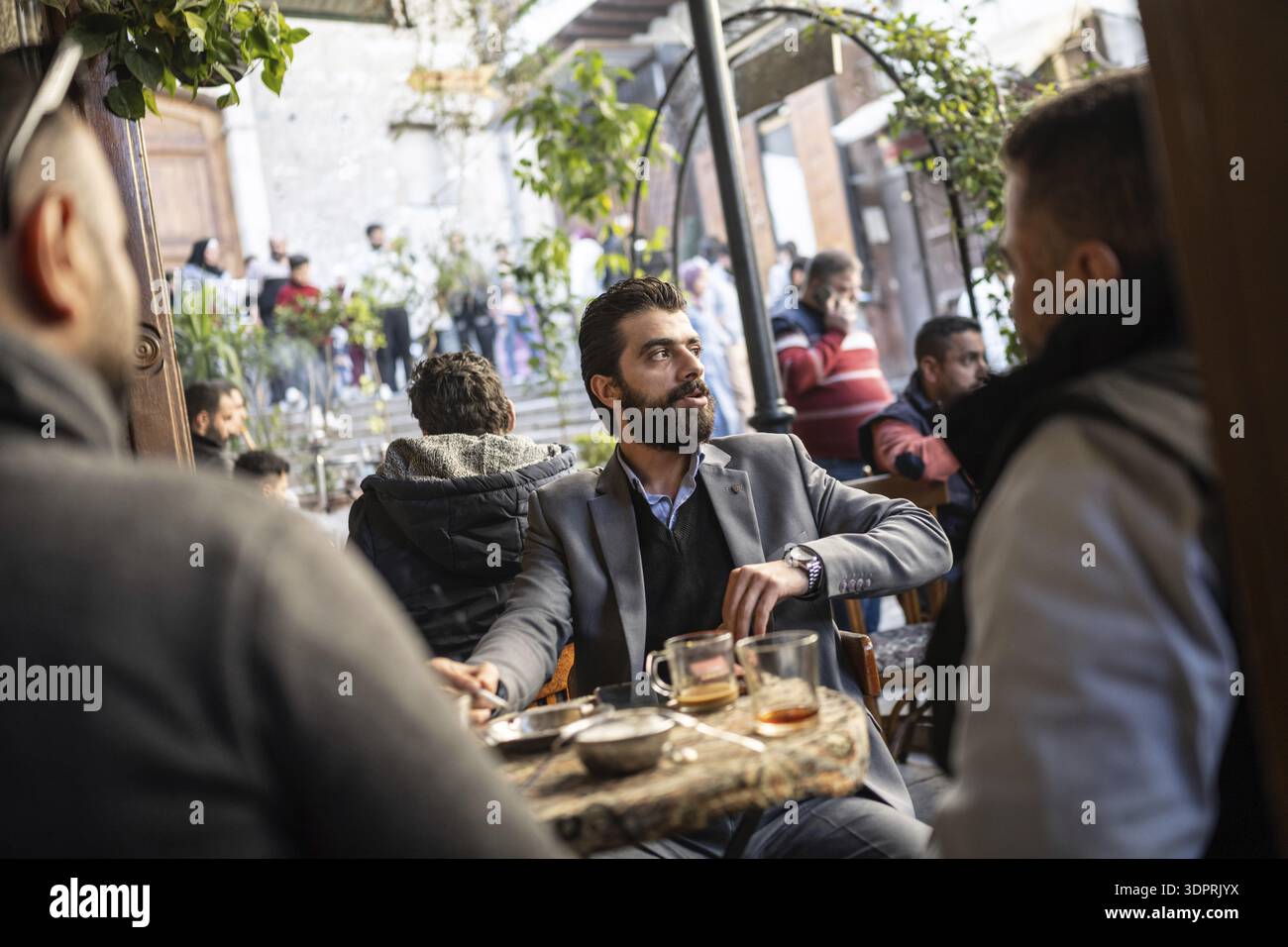 Damascus, Syria. December 4th 2025. Customers drink tea, coffee and ...