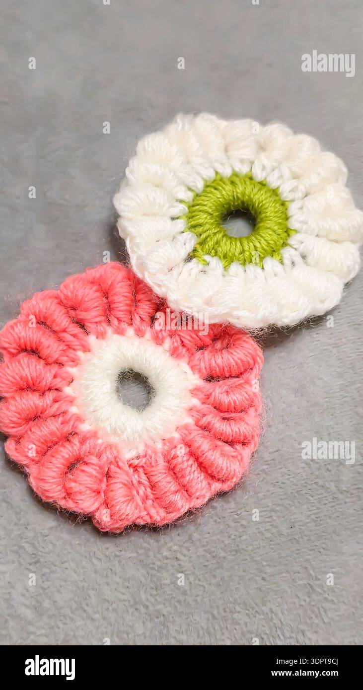 Knitted flowers and circles suitable for home decor, fashion, or ...