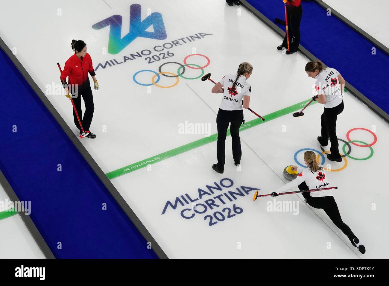 Canada's Sarah Wilkes, Emma Miskew and Tracy Fleury compete during a ...