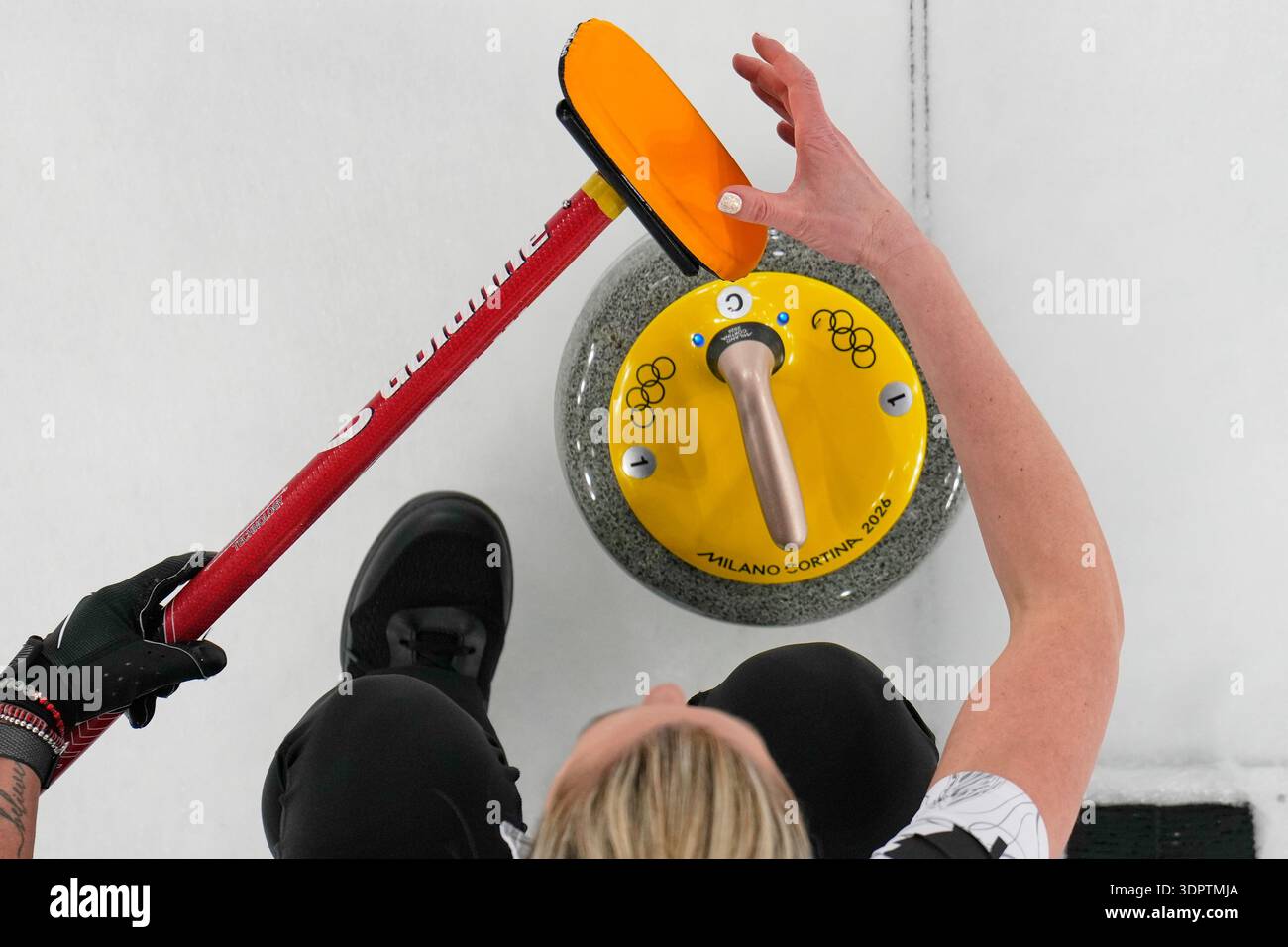 Canada's Emma Miskew prepares to deliver the stone during a women's ...