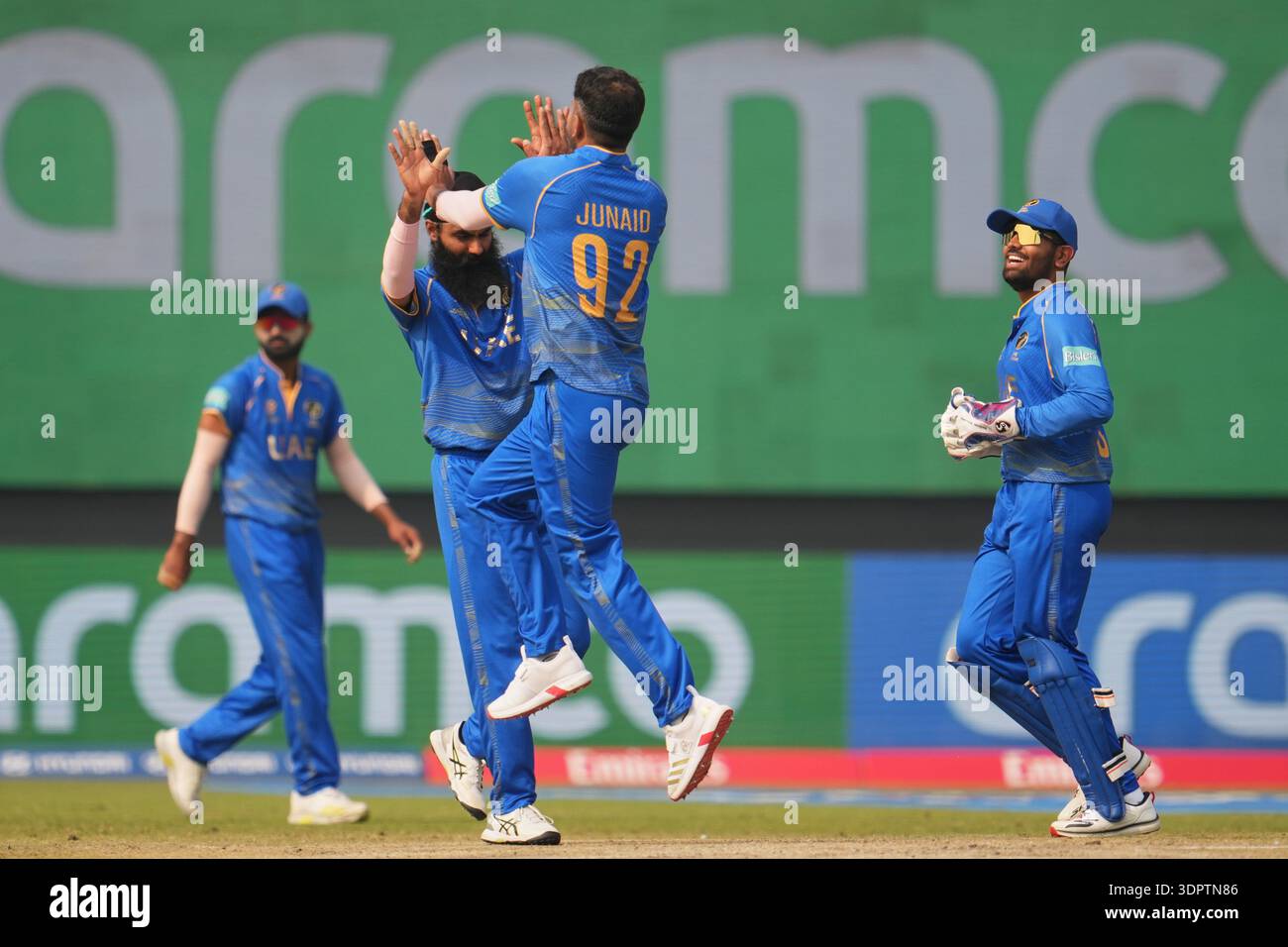 United Arab Emirates' Junaid Siddique, centre, celebrates with ...