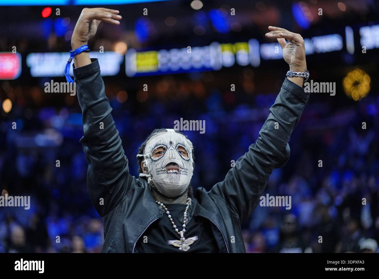 FILE - Rapper Skrilla reacts during an NBA basketball game Thursday ...