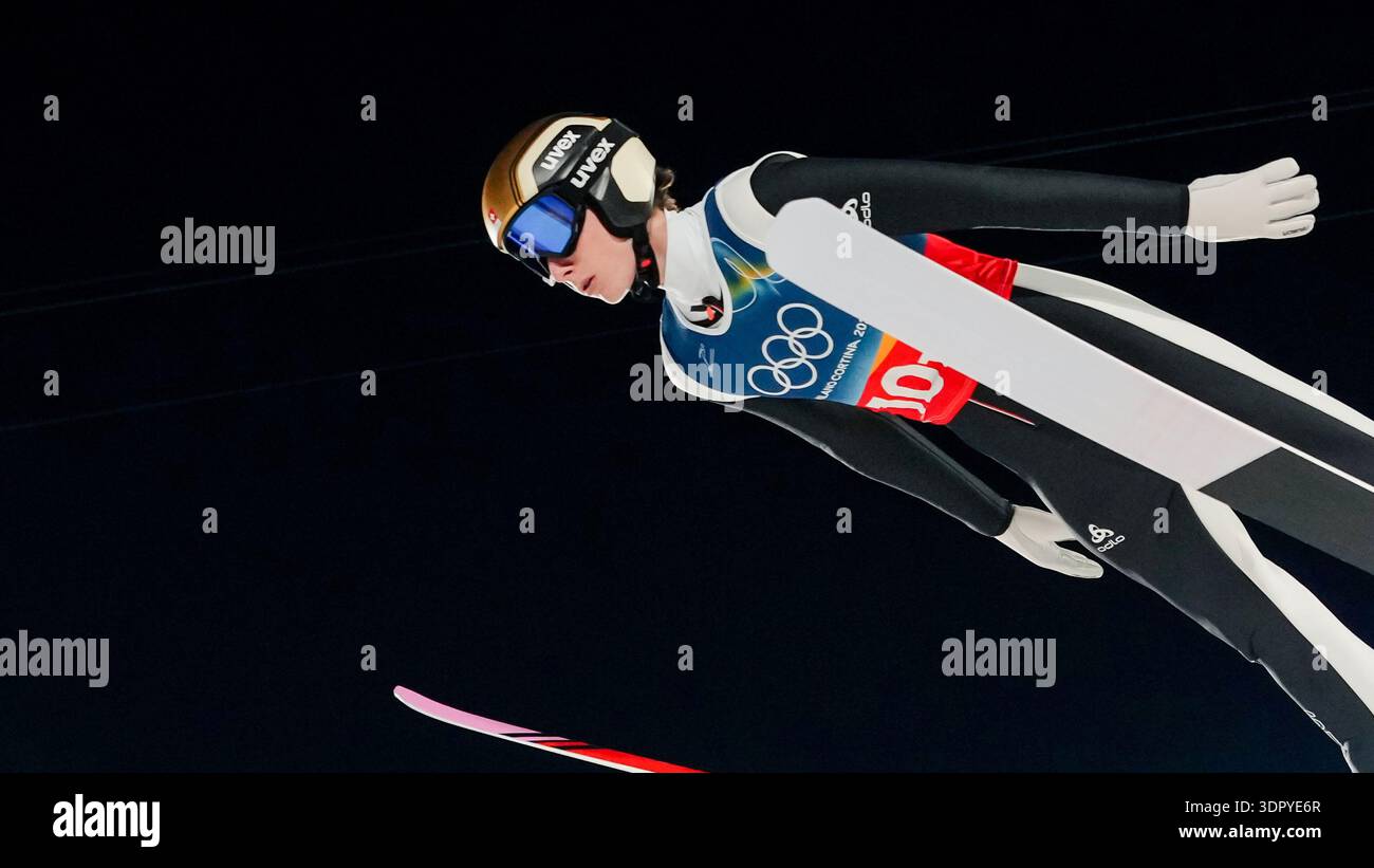 Felix Trunz, of Switzerland, soars through the air during his trial ...