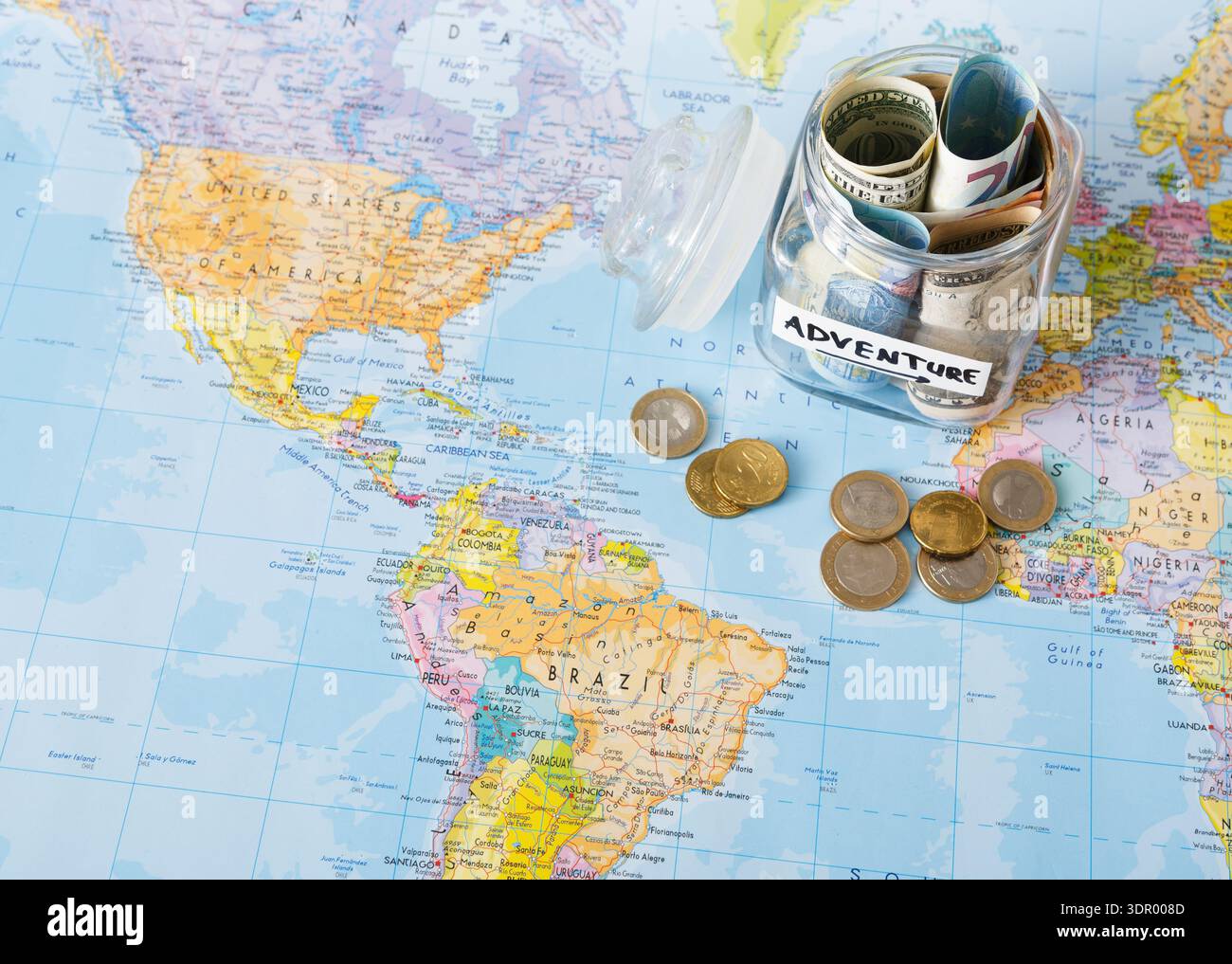 Money Jar for Travel Plans on a World Map Showing Different Countries ...