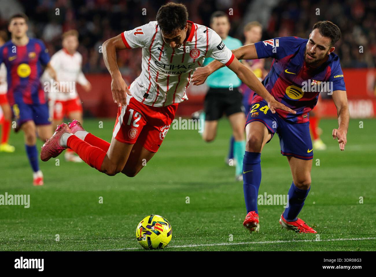 Girona's Vitor Reis is tacked by Barcelona's Eric Garcia during a ...
